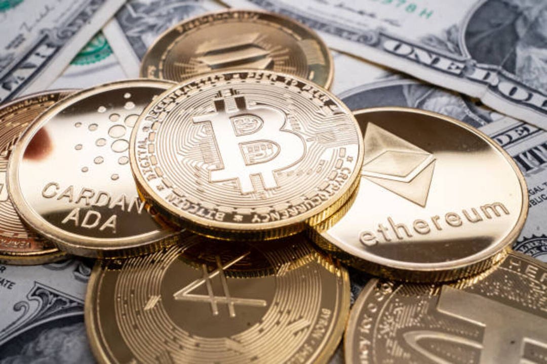 Crypto-linked stocks rise as Bitcoin hovers around $70K (BTC-USD ...